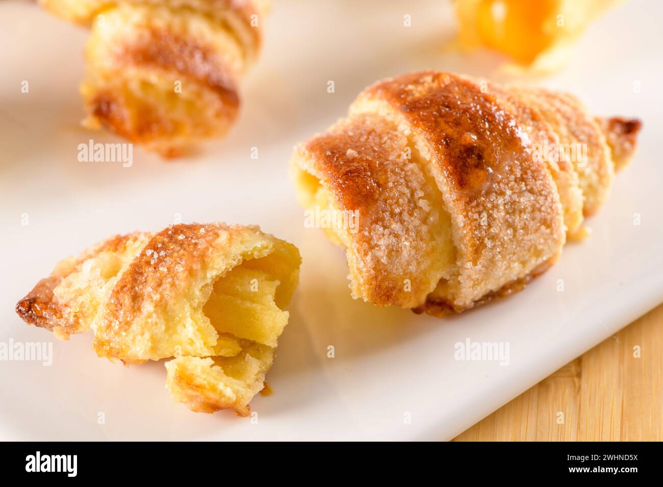 Small croissant with physalis fruits Stock Photo - Alamy