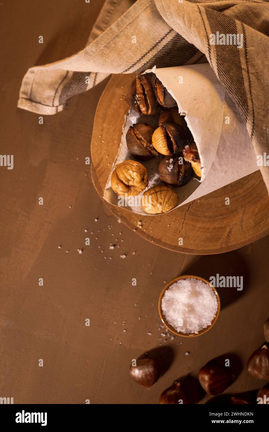 Roasted chestnuts in a paper cone Stock Photo - Alamy