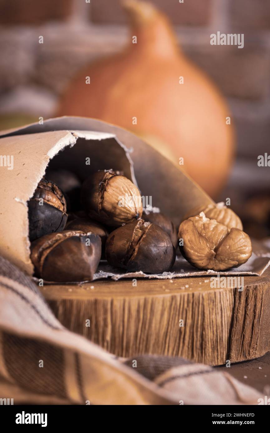 Roasted chestnuts in a paper cone Stock Photo - Alamy
