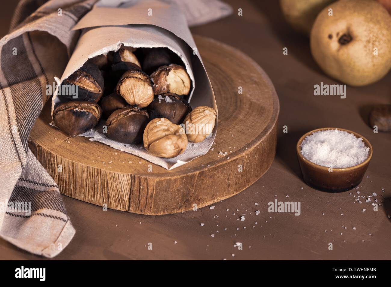 Roasted chestnuts in a paper cone Stock Photo - Alamy