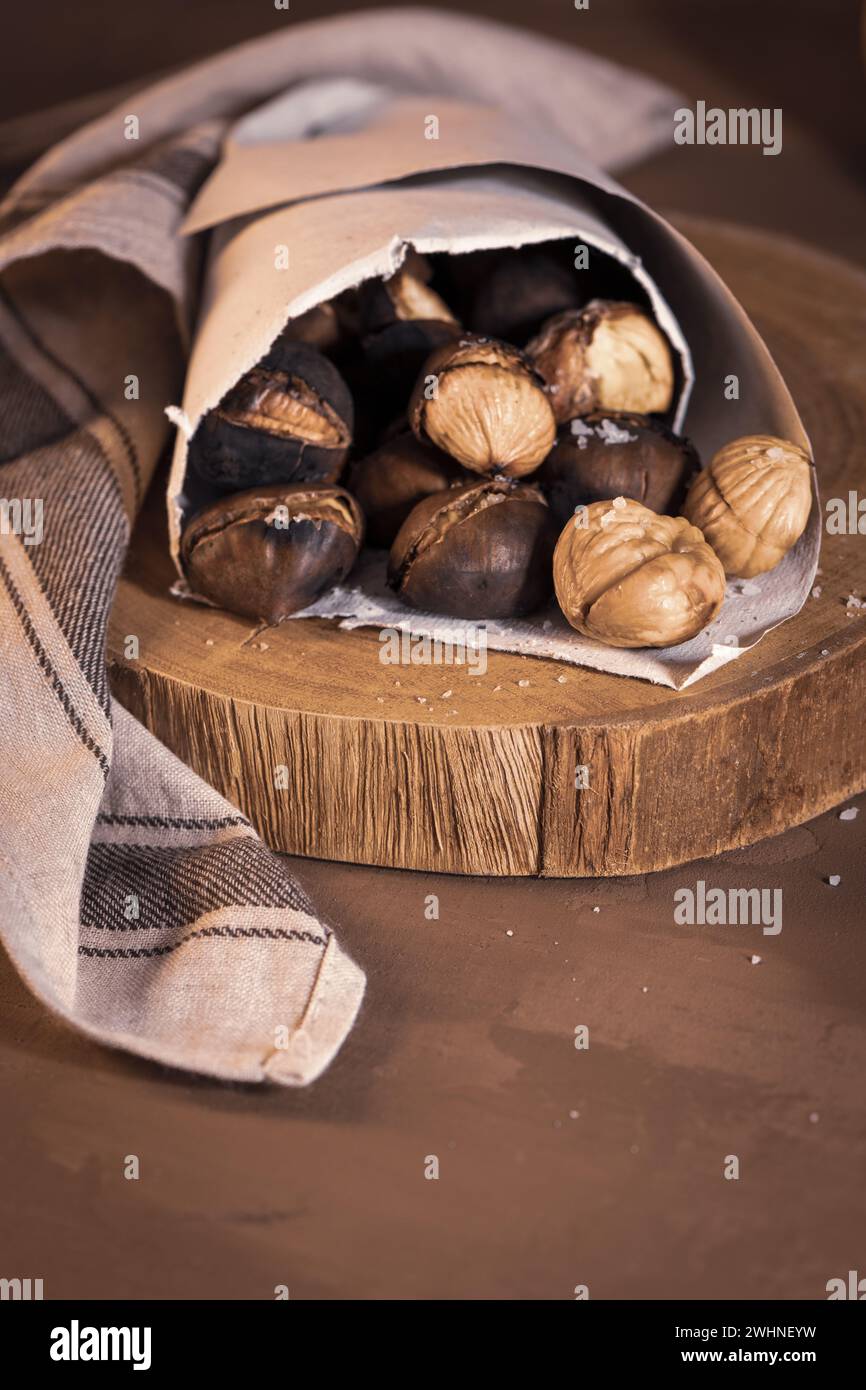 Roasted chestnuts in a paper cone Stock Photo - Alamy
