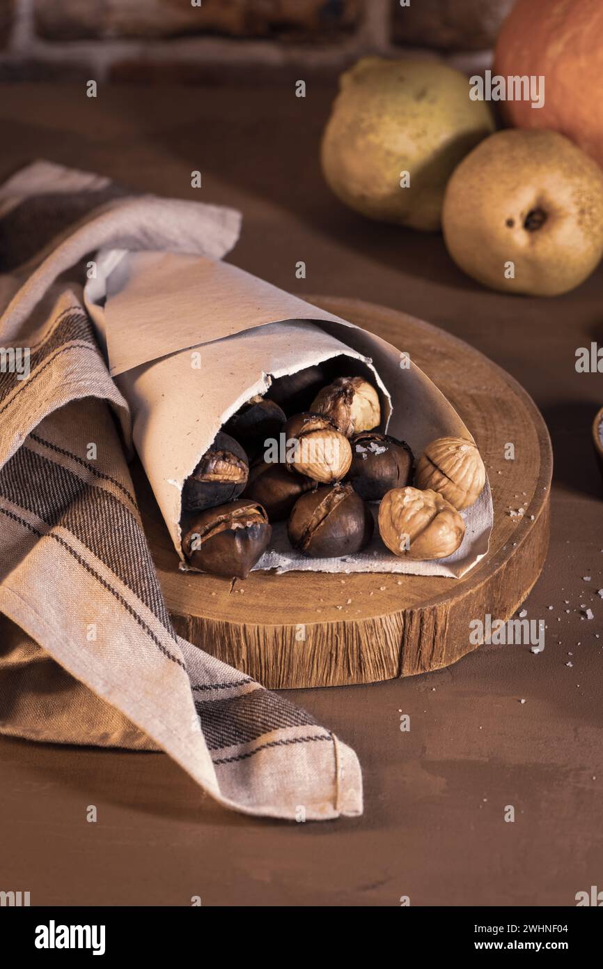 Roasted chestnuts in a paper cone Stock Photo - Alamy