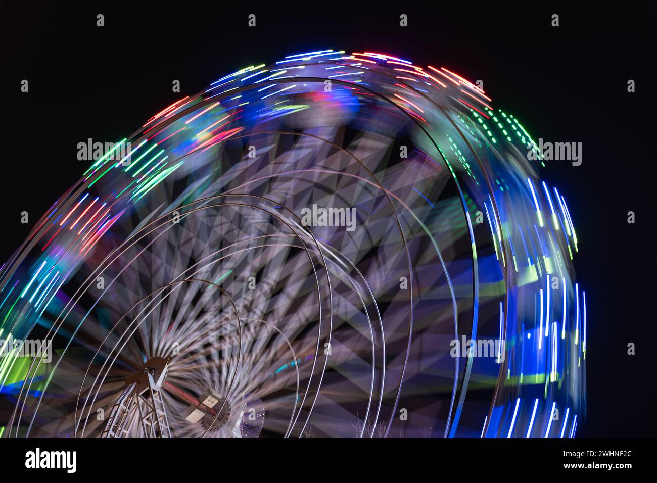 Spinning ferris wheel in motion Stock Photo - Alamy