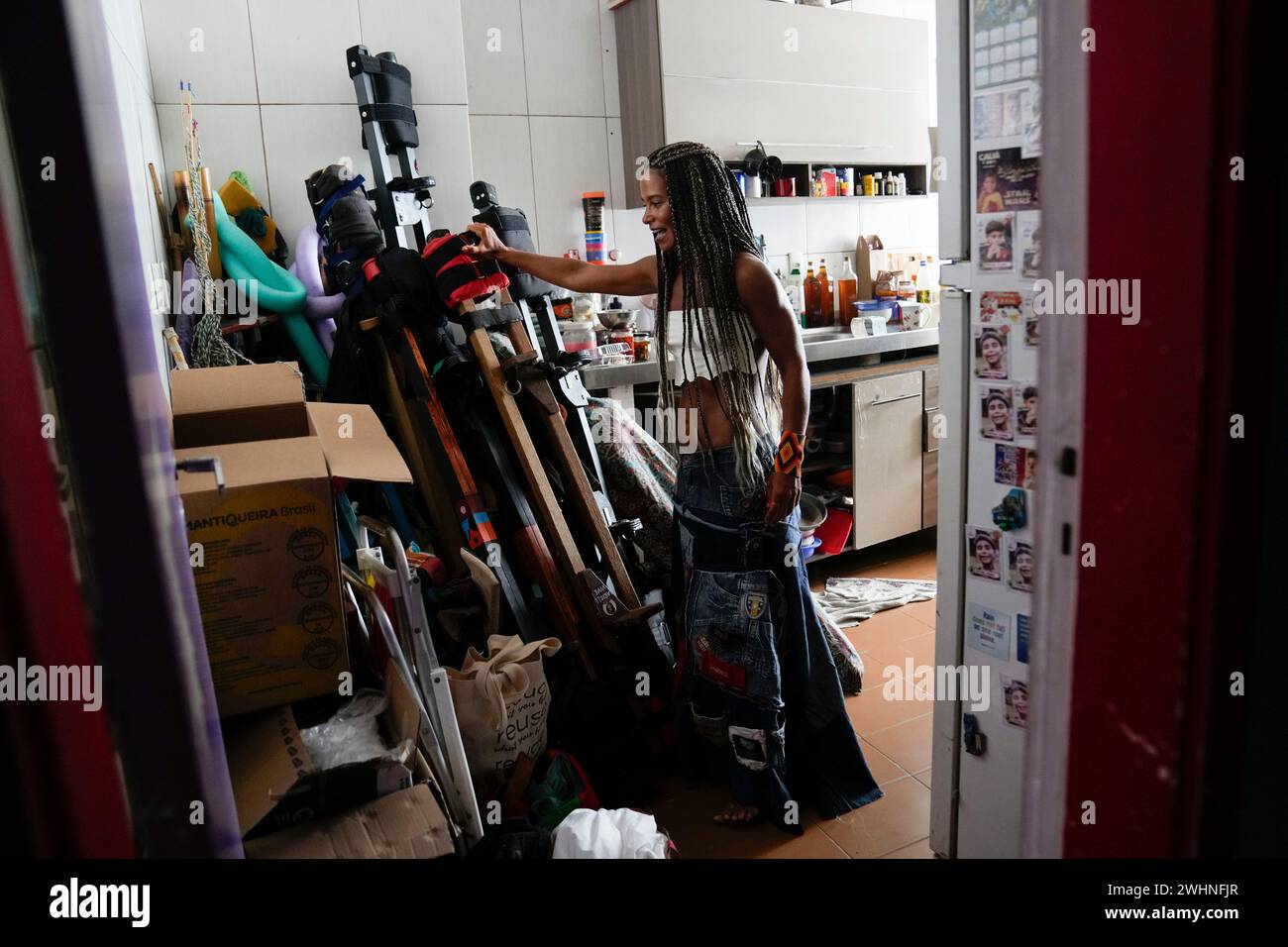 Raquel Potí shows her collection of wooden stilts stored in the kitchen ...