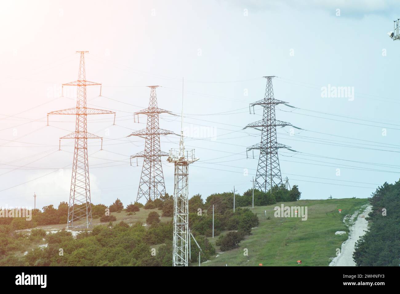 High voltage towers with sky background. Power line support with wires ...