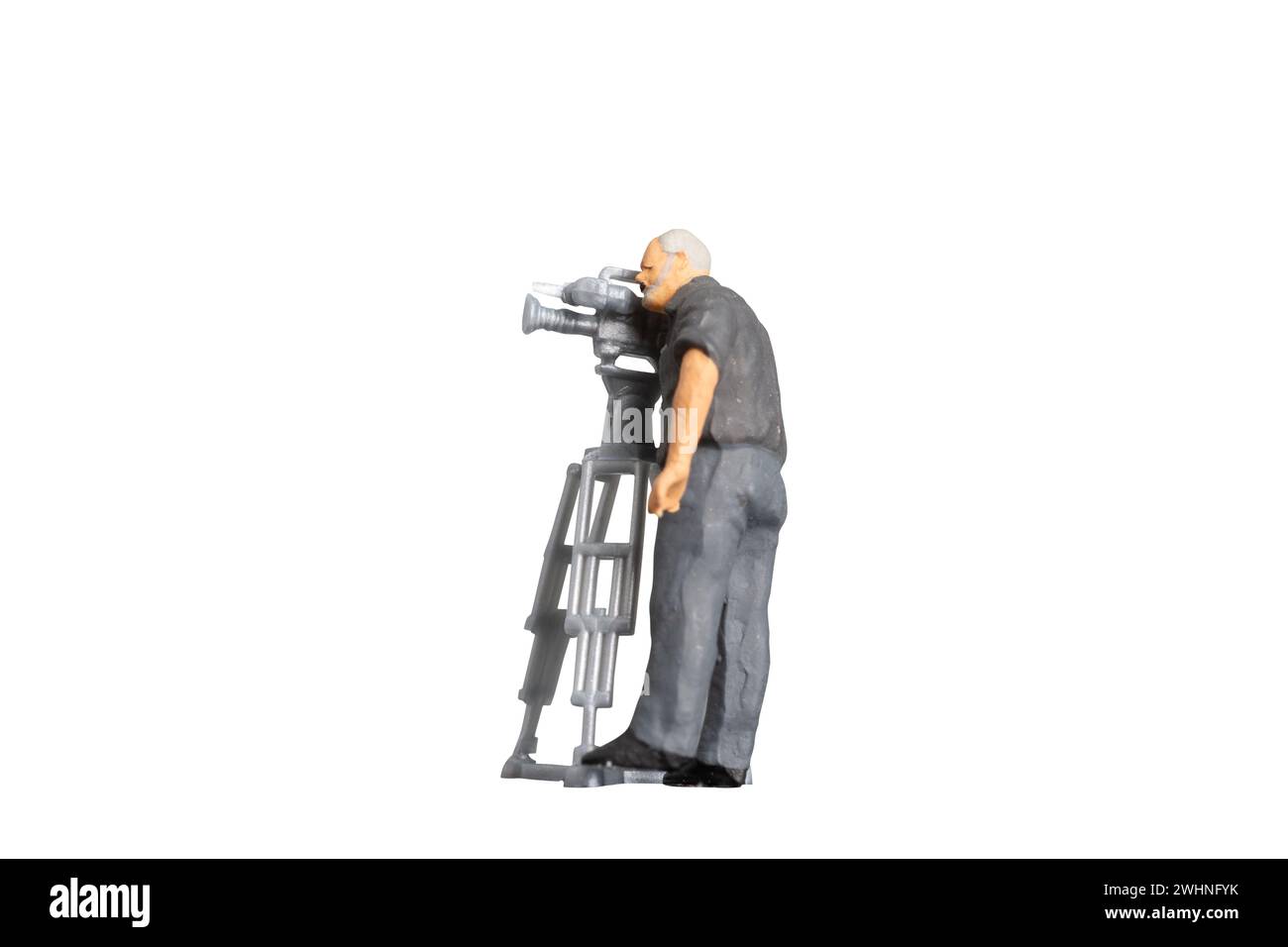 Cameraman working with television camera on a tripod isolated on white ...