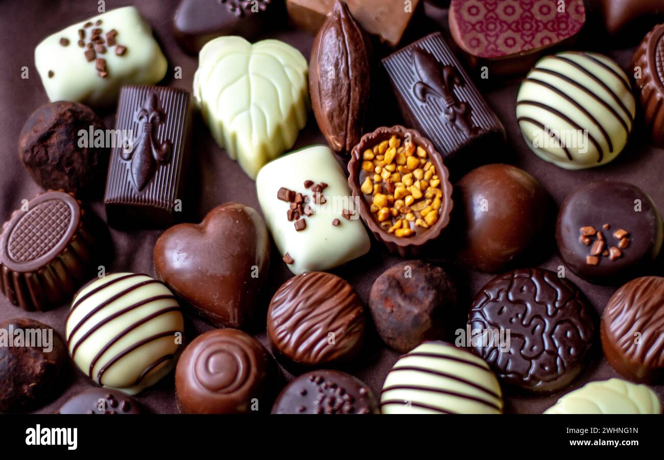 Display of fancy gourmet chocolates makes a delicious background Stock ...