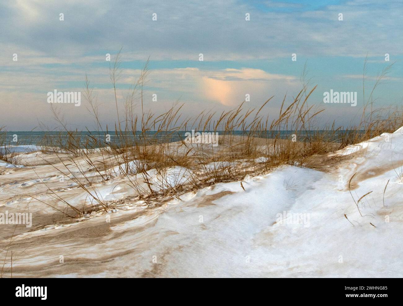 A frozen beach on Lake Michigan makes a beautiful and cold landscape ...