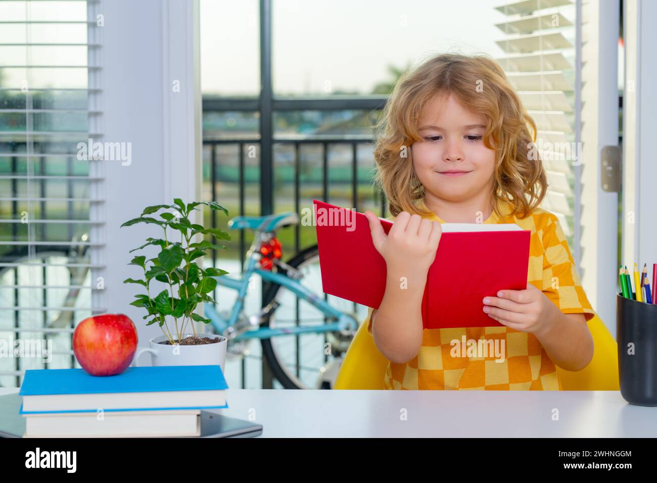 School kid reading book. School child student learning at home, study ...