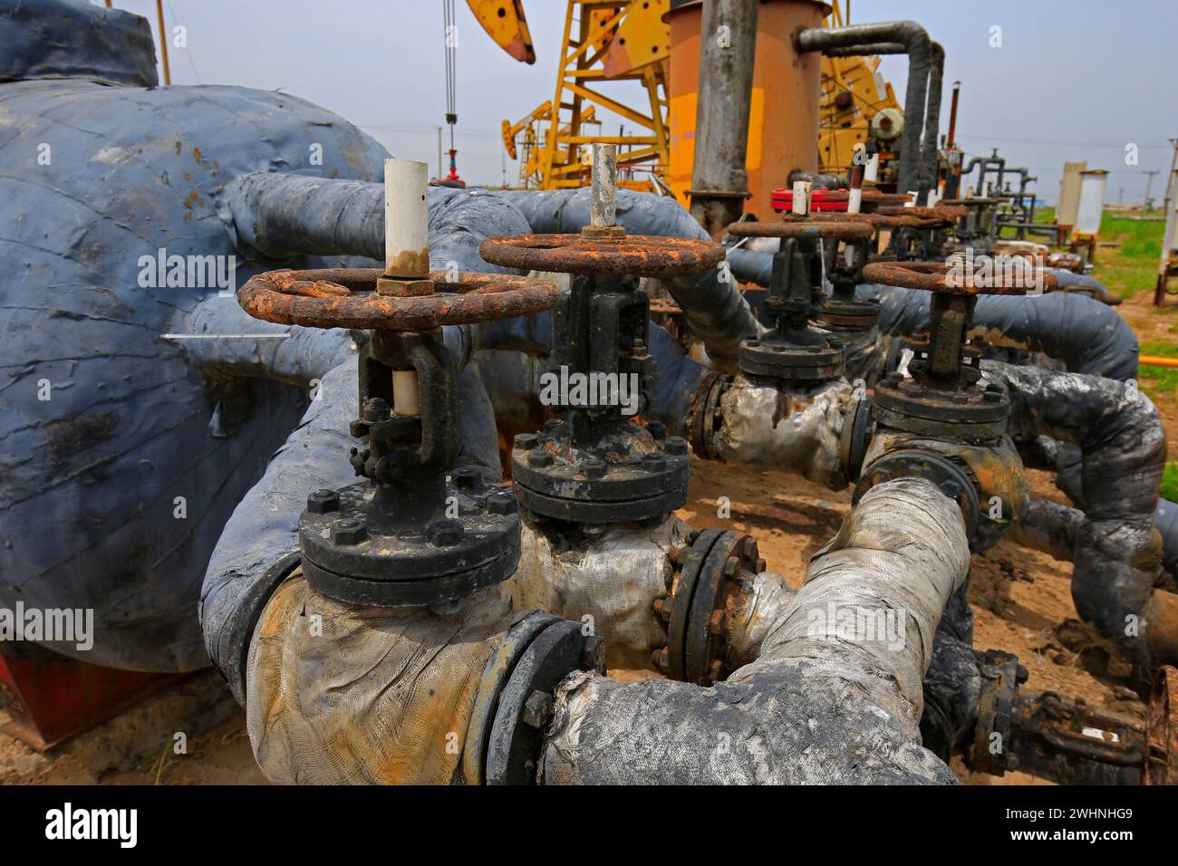 Oil pipes and valves Stock Photo - Alamy