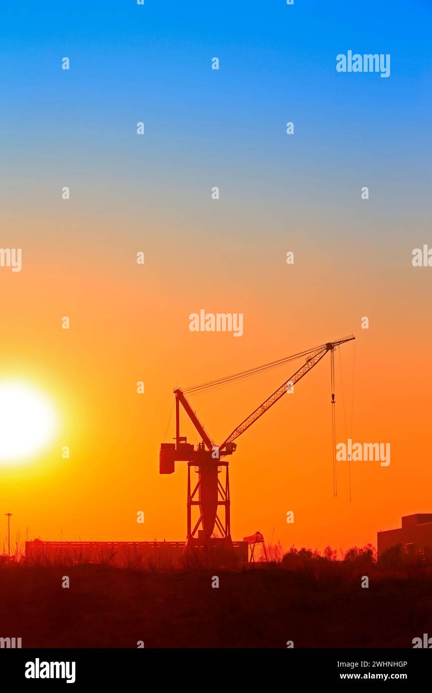 Port crane unloading container ships Stock Photo - Alamy