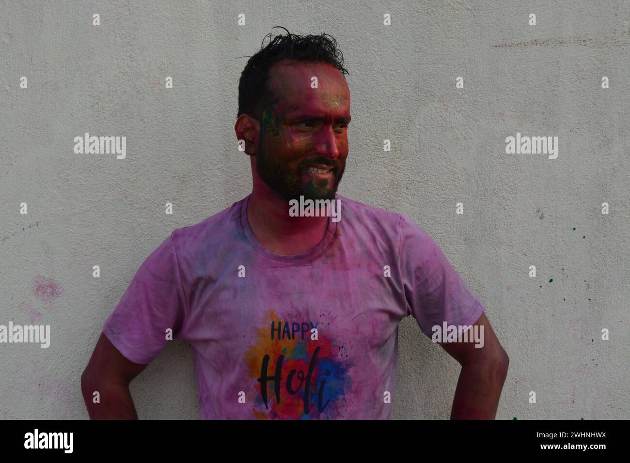 Portrait of a young Indian boy playing holi. Happy boy enjoying in holi ...