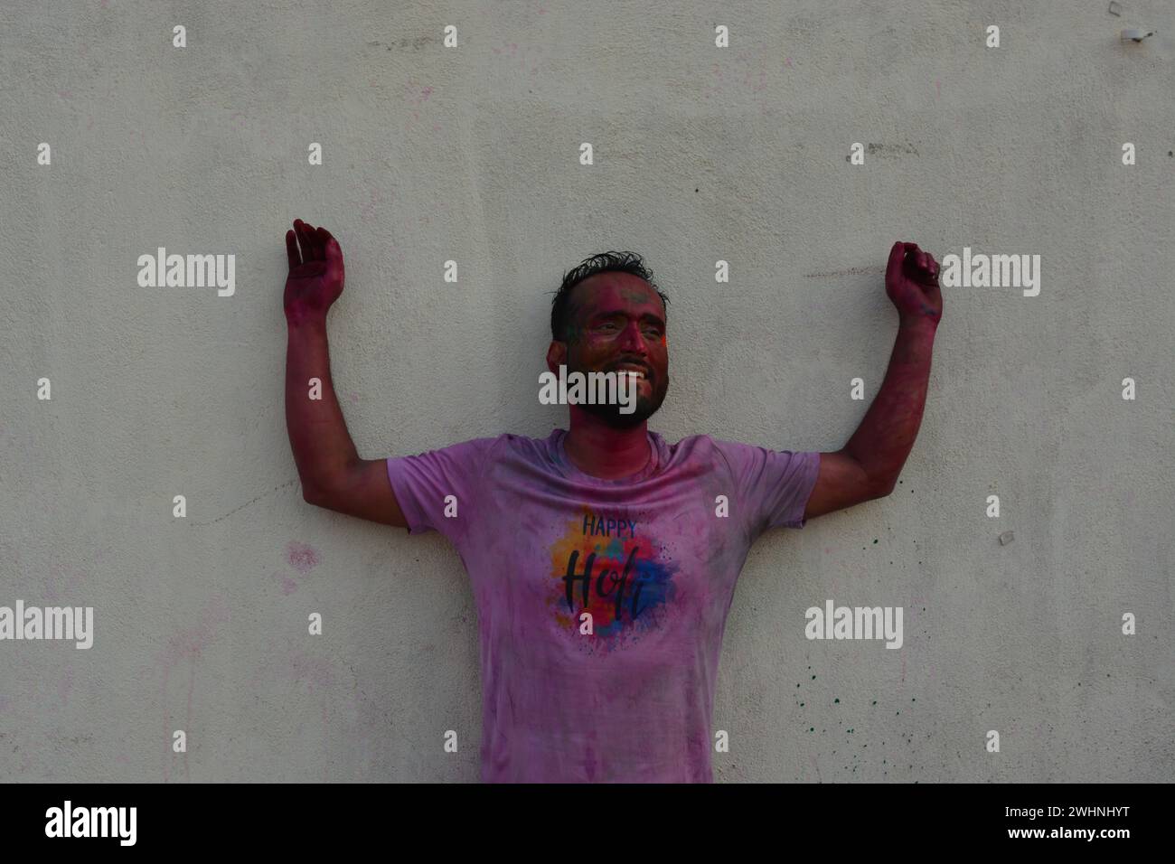 Portrait of a young Indian boy playing holi. Happy boy enjoying in holi ...