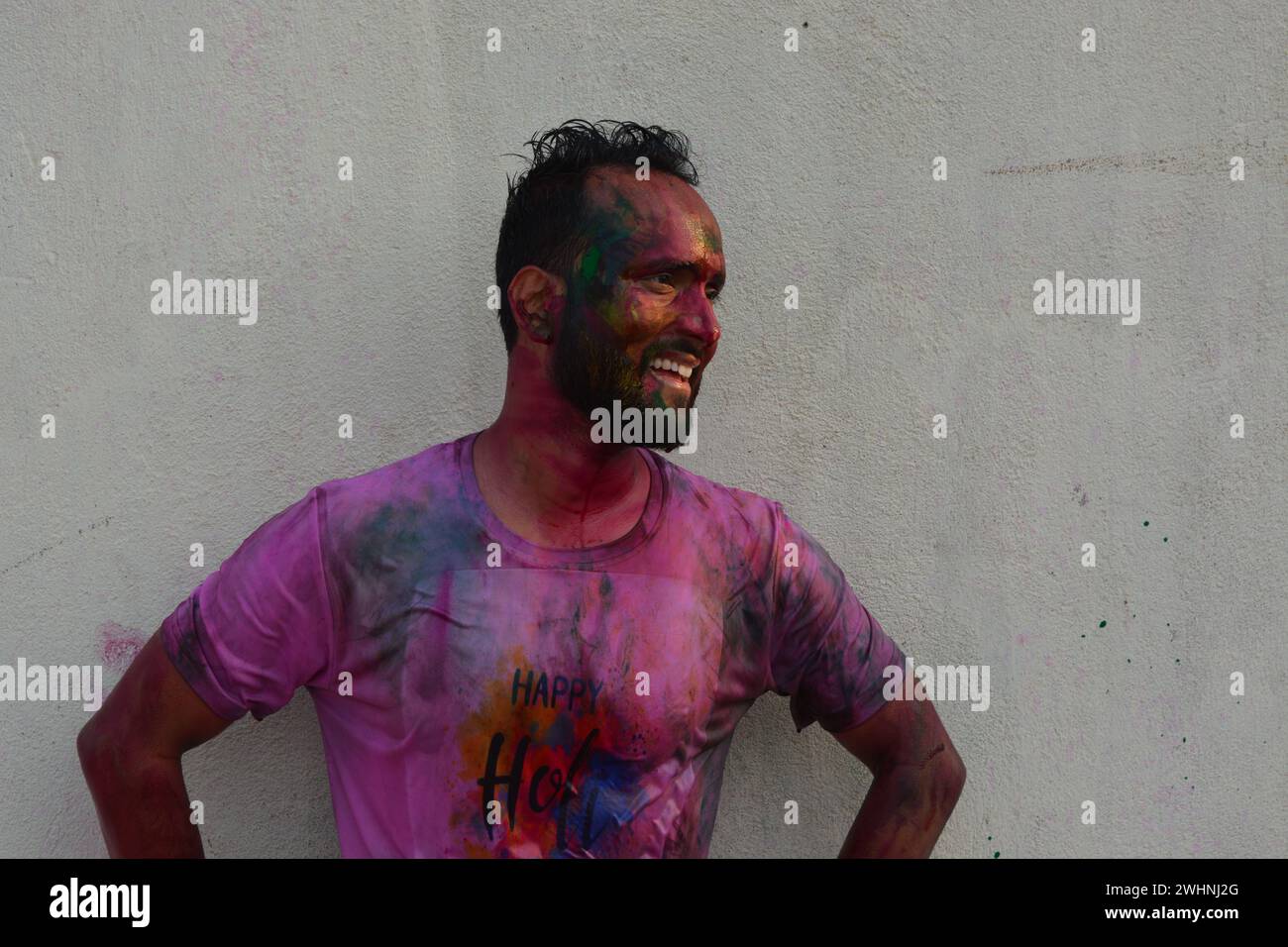 Portrait of a young Indian boy playing holi. Happy boy enjoying in holi ...
