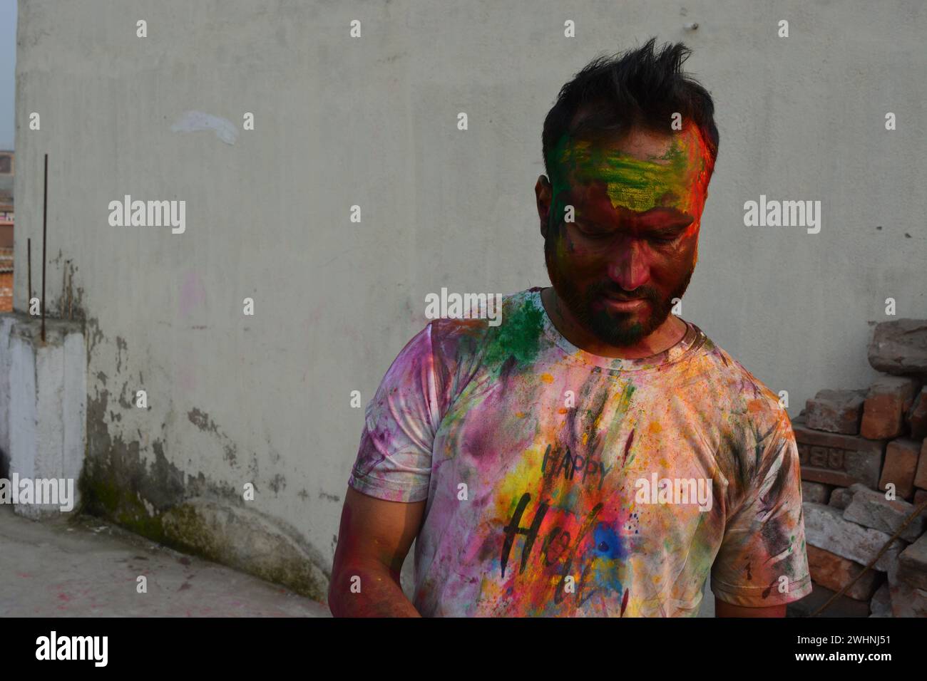Portrait of a young Indian boy playing holi. Happy boy enjoying in holi ...