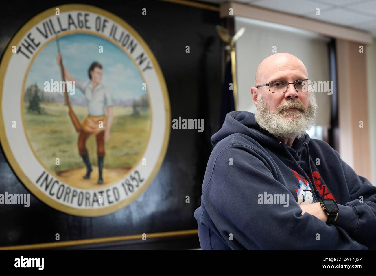 Ilion Mayor John Stephens poses for a picture in front of the seal of the village at the ...