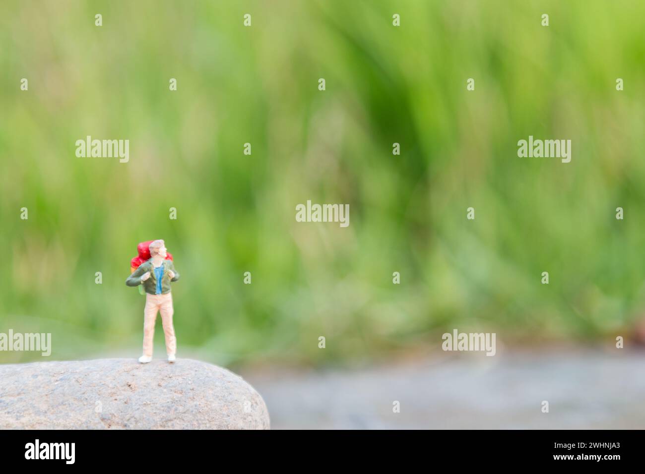 Traveler miniature mini figure with backpack stand and walking on ...