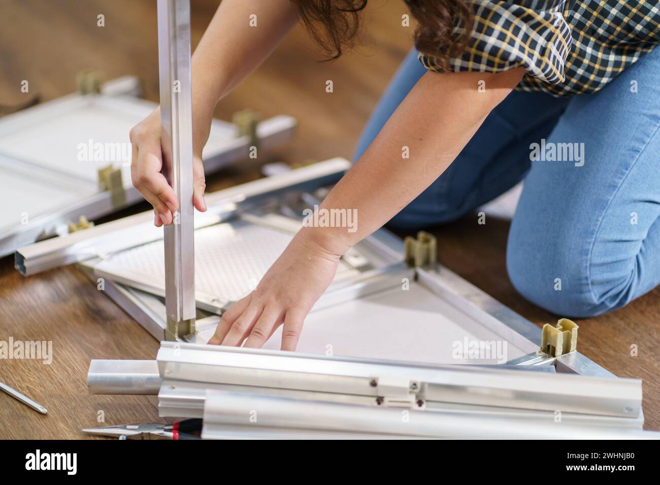Asian Woman self repairs furniture renovation using equipment to diy ...