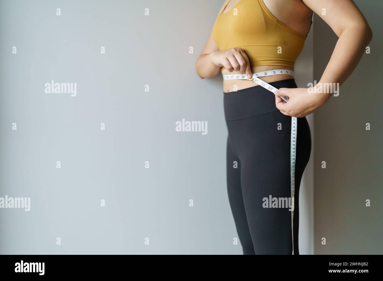 Woman want to lose weight with a centimeter Shape up healthy stomach ...