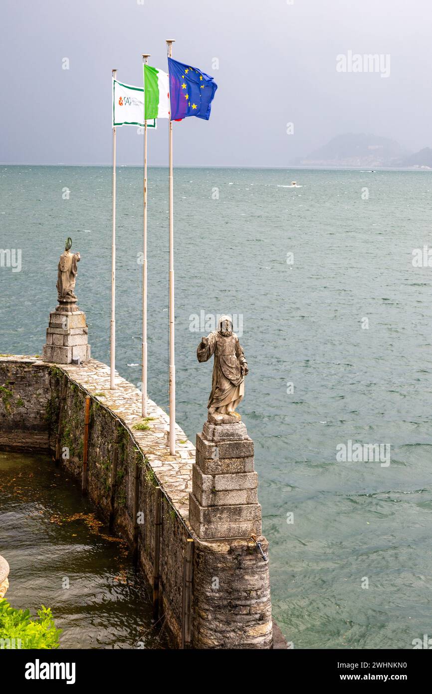Old statues look out from the Villa del Balbianello across Lake Como on ...