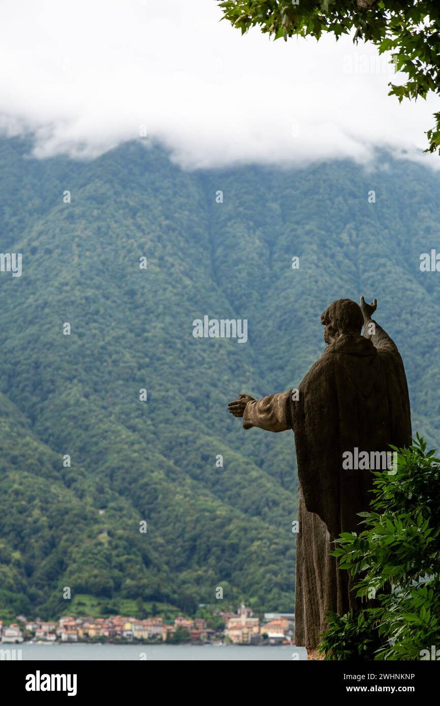 An old statue looks across Lake Como from the Villa del Balbianello ...