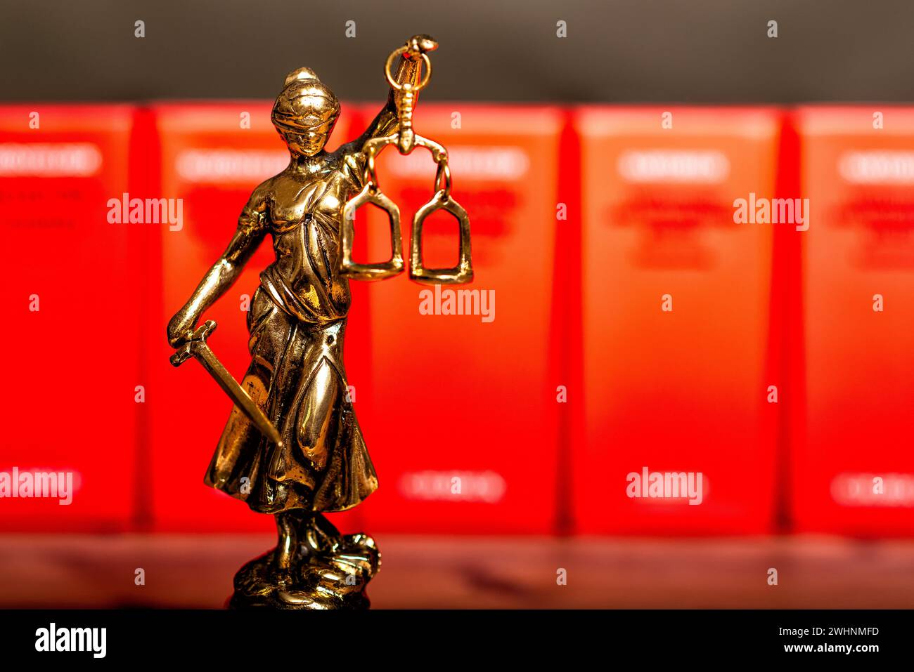 Statue of Lady Justice, goddess Justitia, on the desk in a lawyer's ...