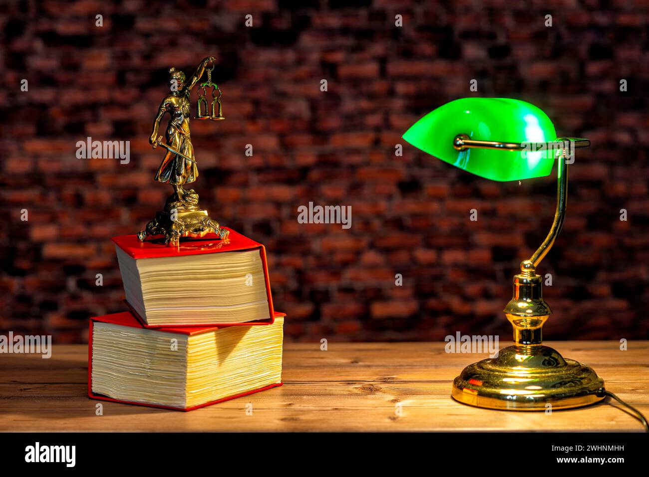 Statue of Lady Justice, goddess Justitia, on the desk in a lawyer's ...