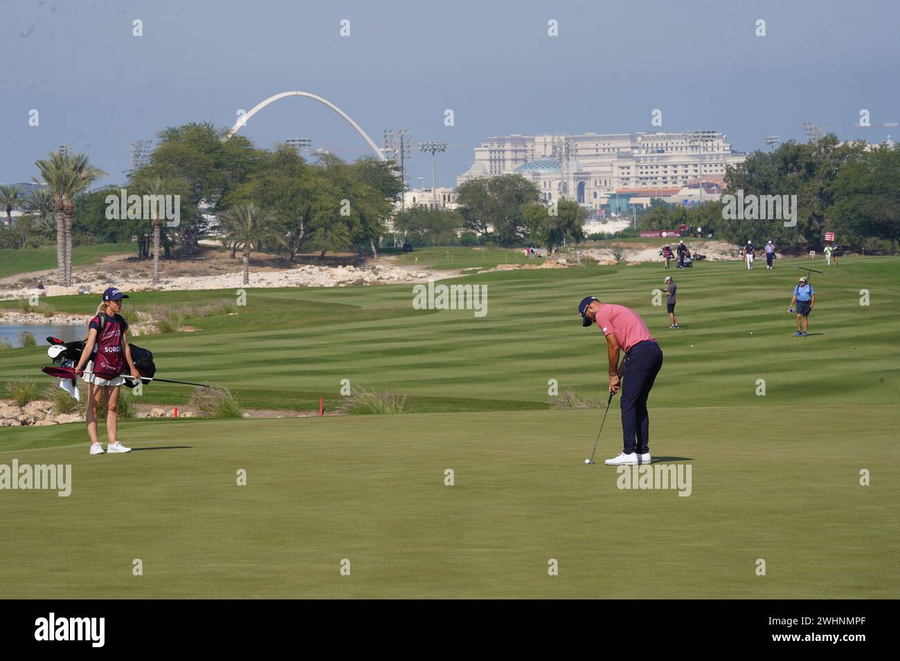 Golfers in action at the Commercial Bank Qatar Masters golf tournament in Doha Stock Photo - Alamy