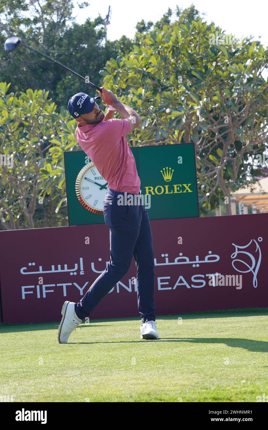 Golfers in action at the Commercial Bank Qatar Masters golf tournament ...
