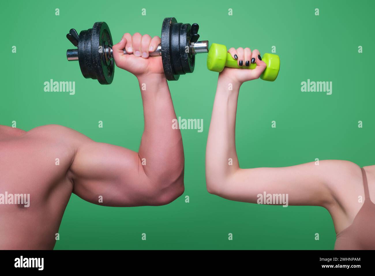 Dumbbell workout. Male and female hands with dumbbells close-up ...