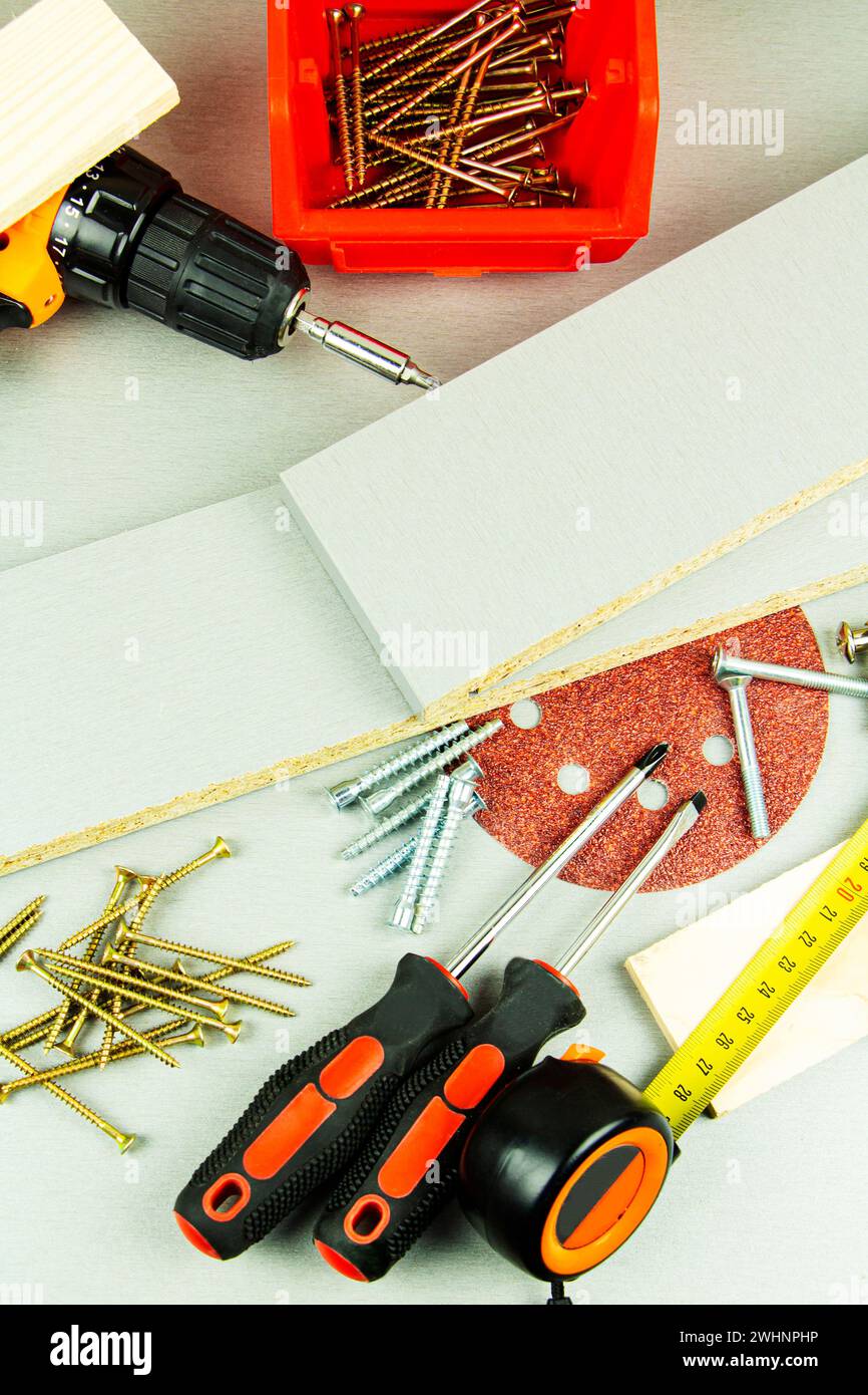 Furniture fittings. Furniture assembly hardware options and tools on a ...