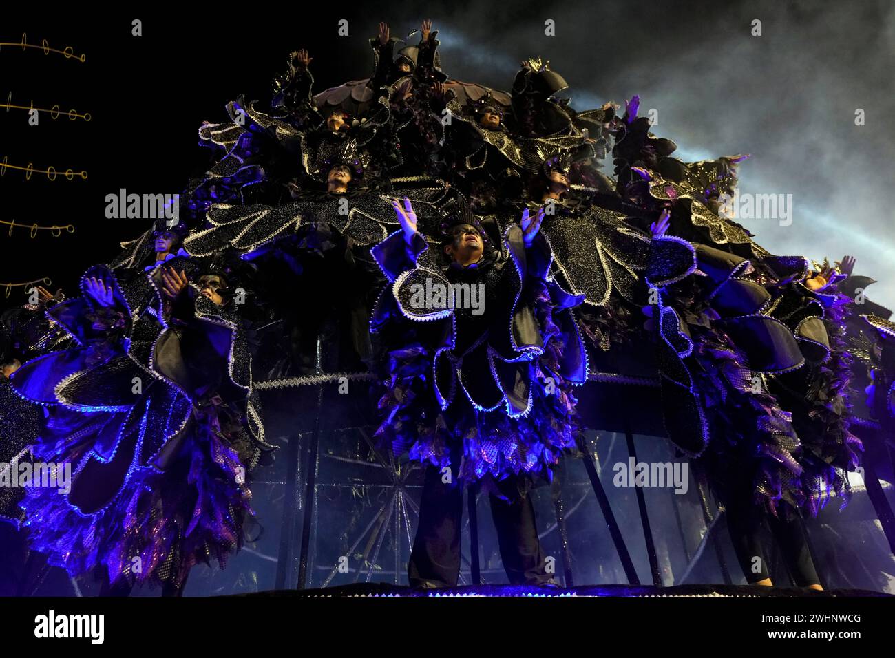 Dancers from the Gavioes da Fiel samba school perform on a float during ...