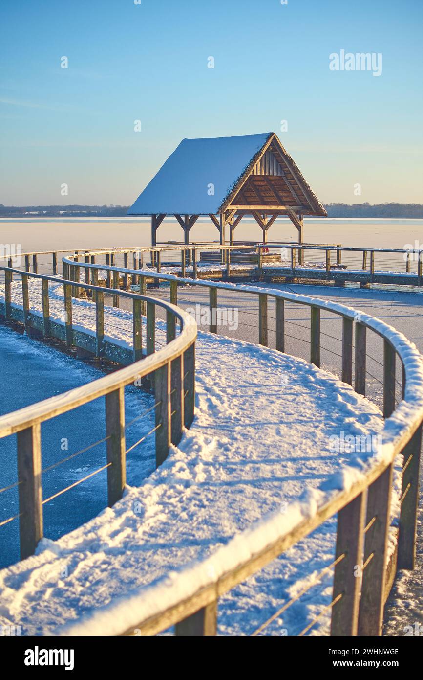 Curved footbridge over lake in northern Germany in Winter Stock Photo ...