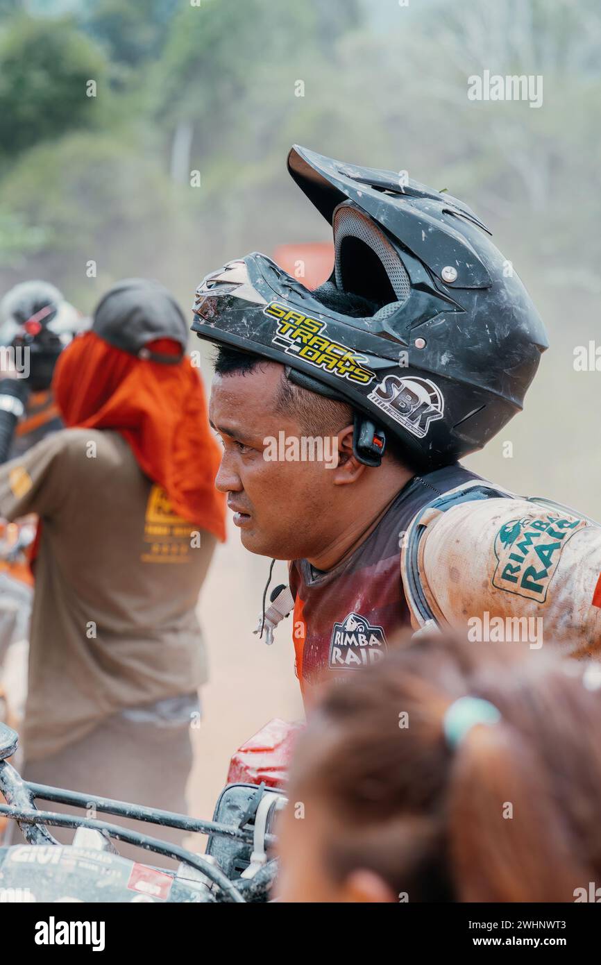 Tired motorcyclist at the finished line of enduro motorcross during ...