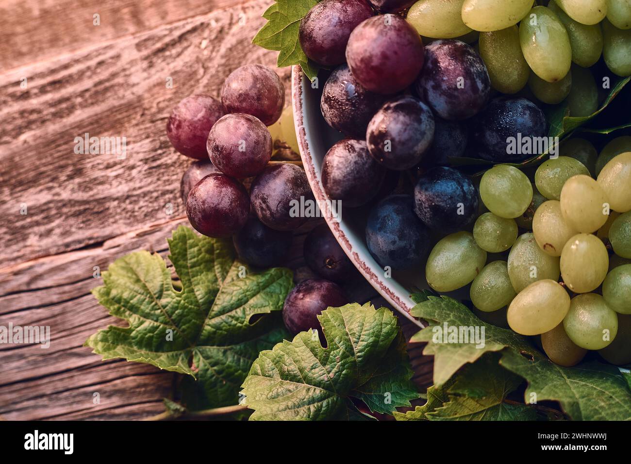 Grapes on wooden rustic table hi-res stock photography and images - Alamy