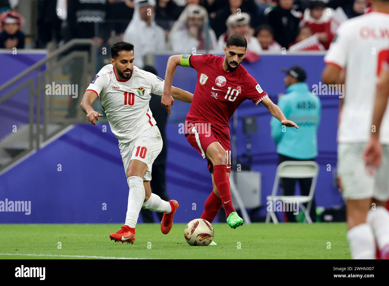 Lusail, Qatar. 10th Feb, 2024. Hassan Al-Haydos (QAT), Mousa Altamari ...