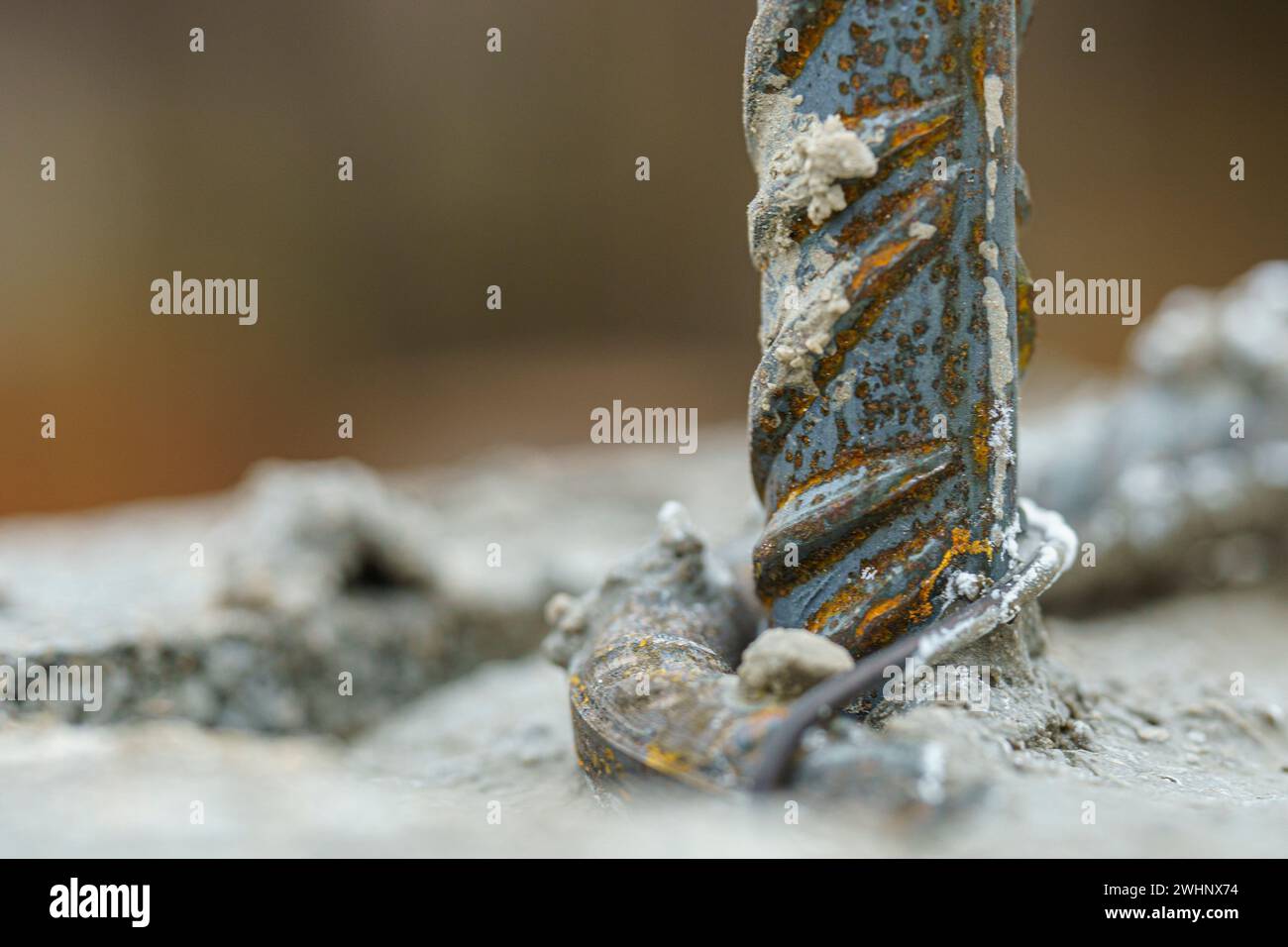 Rustic iron sculpture atop beach rock Stock Photo - Alamy