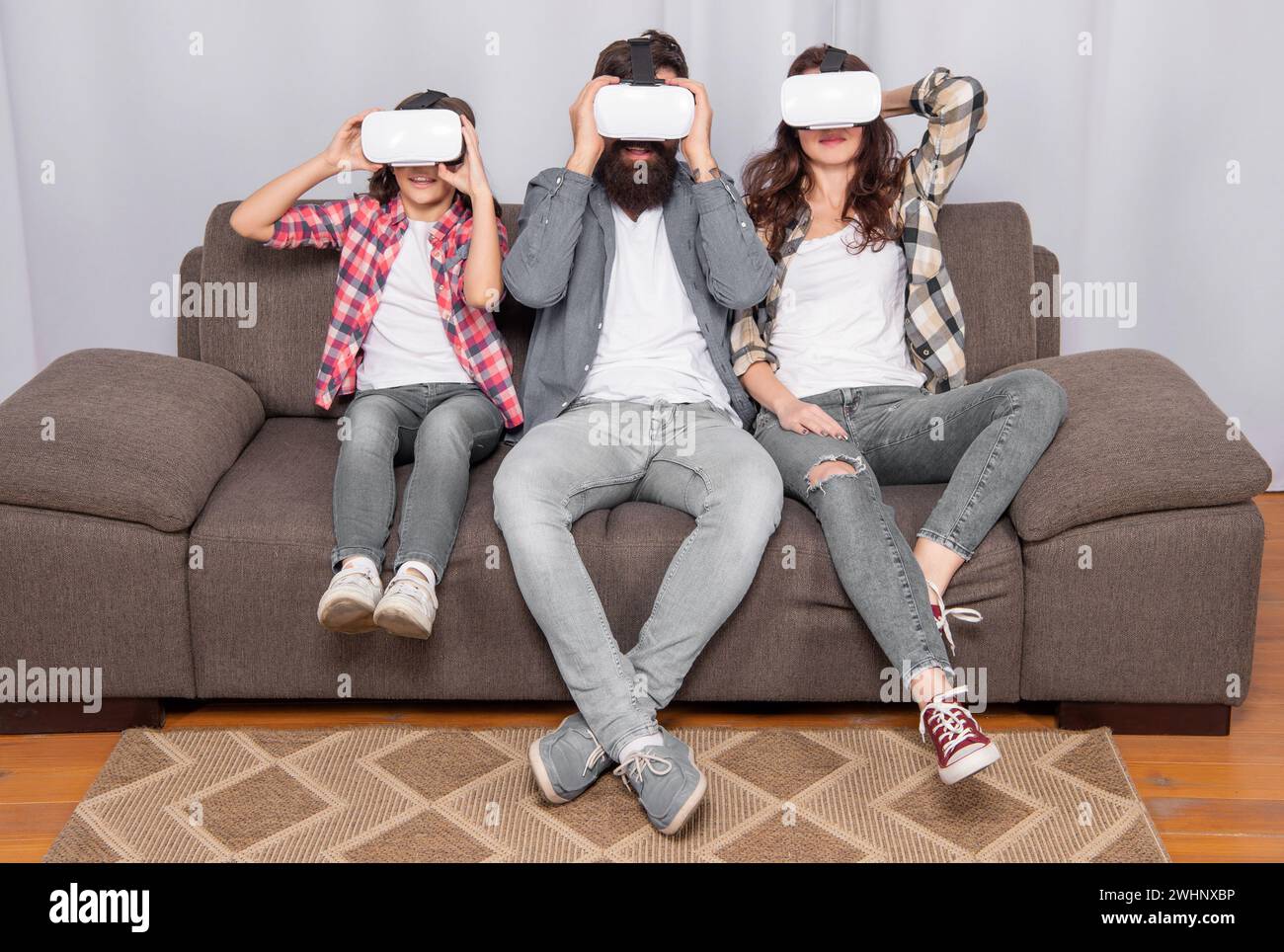 mom dad and daughter. digital future and innovation. modern life ...