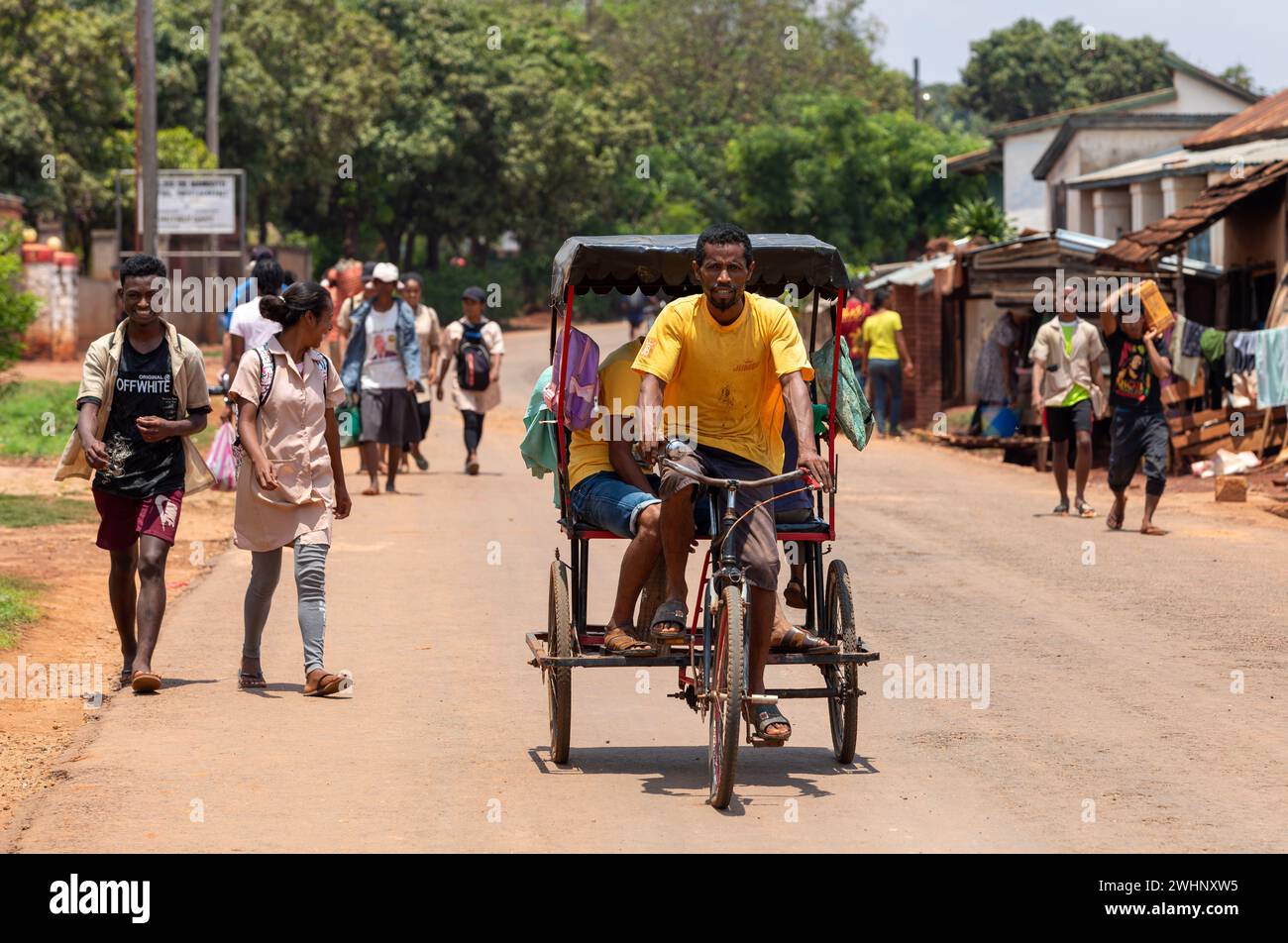 Traditional rickshaw on the Mandoto city streets. Rickshaws are a ...