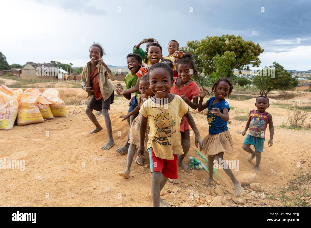 Curious group of children looking at a tourist in Ilakaka. Madagascar ...