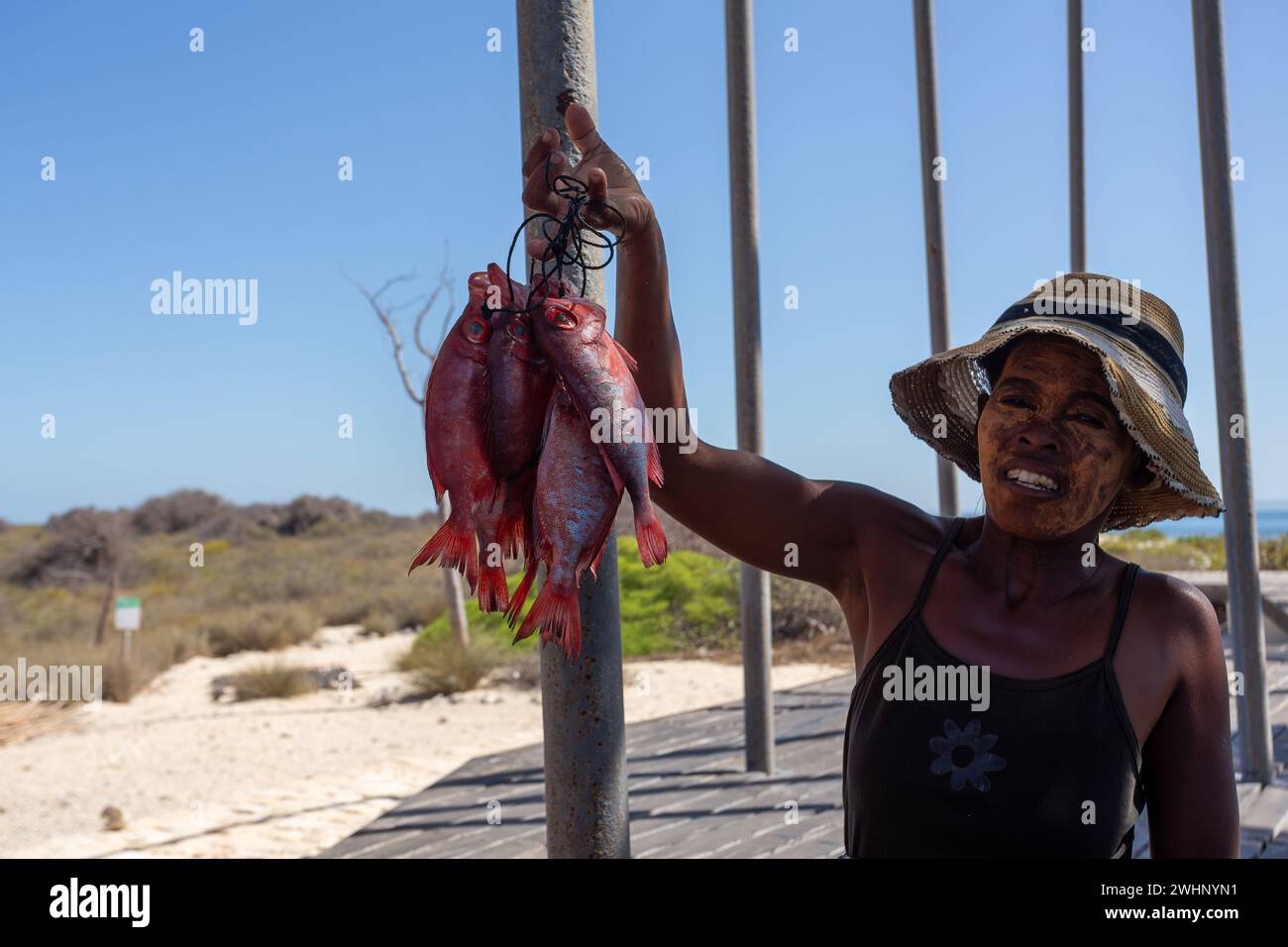 Island Nosy Ve, Madagascar - November 23rd 2022: A woman holding up a ...