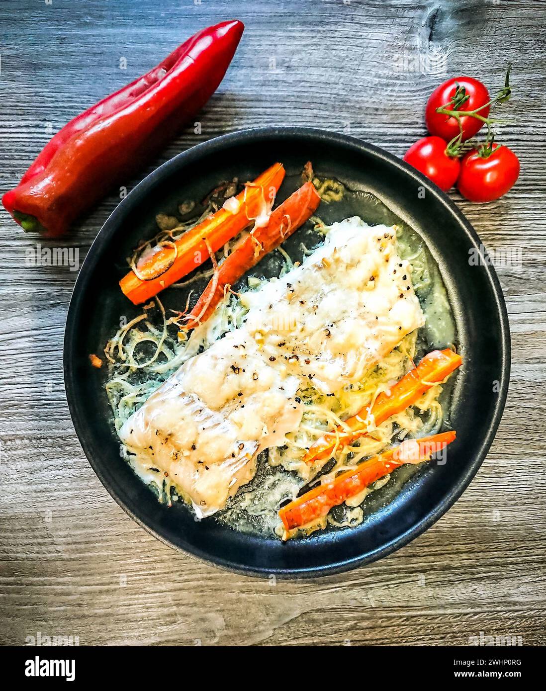 Baked cod fillet with vegetables Stock Photo - Alamy
