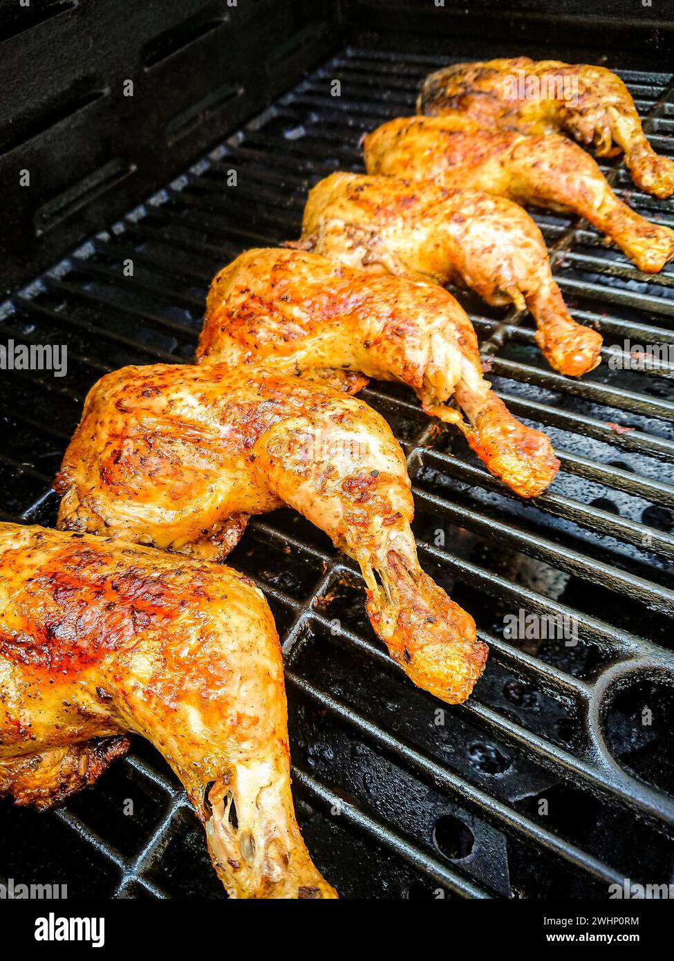 Six golden chicken legs on the grill Stock Photo - Alamy