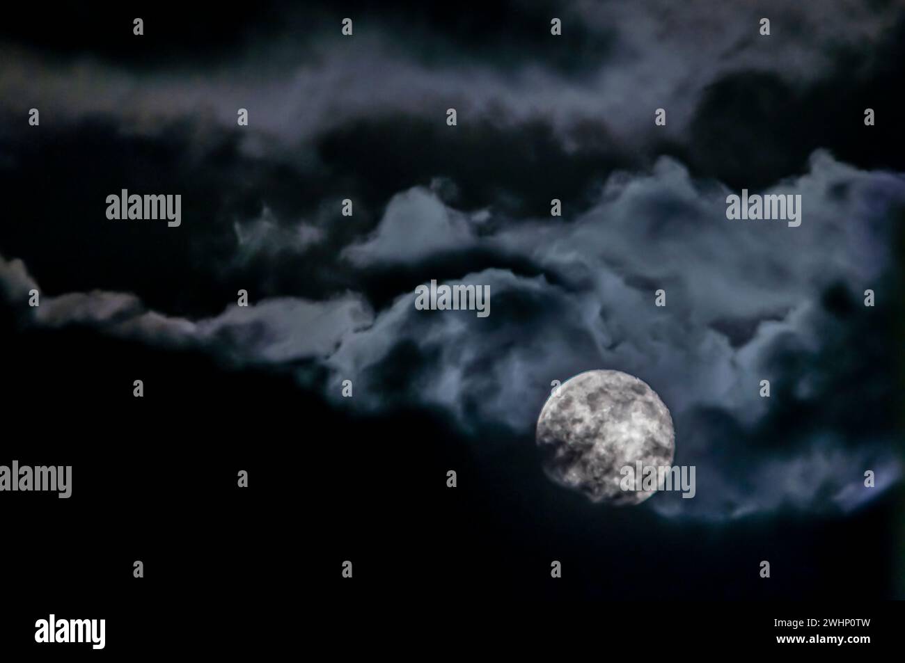 Full moon covered by clouds Stock Photo - Alamy