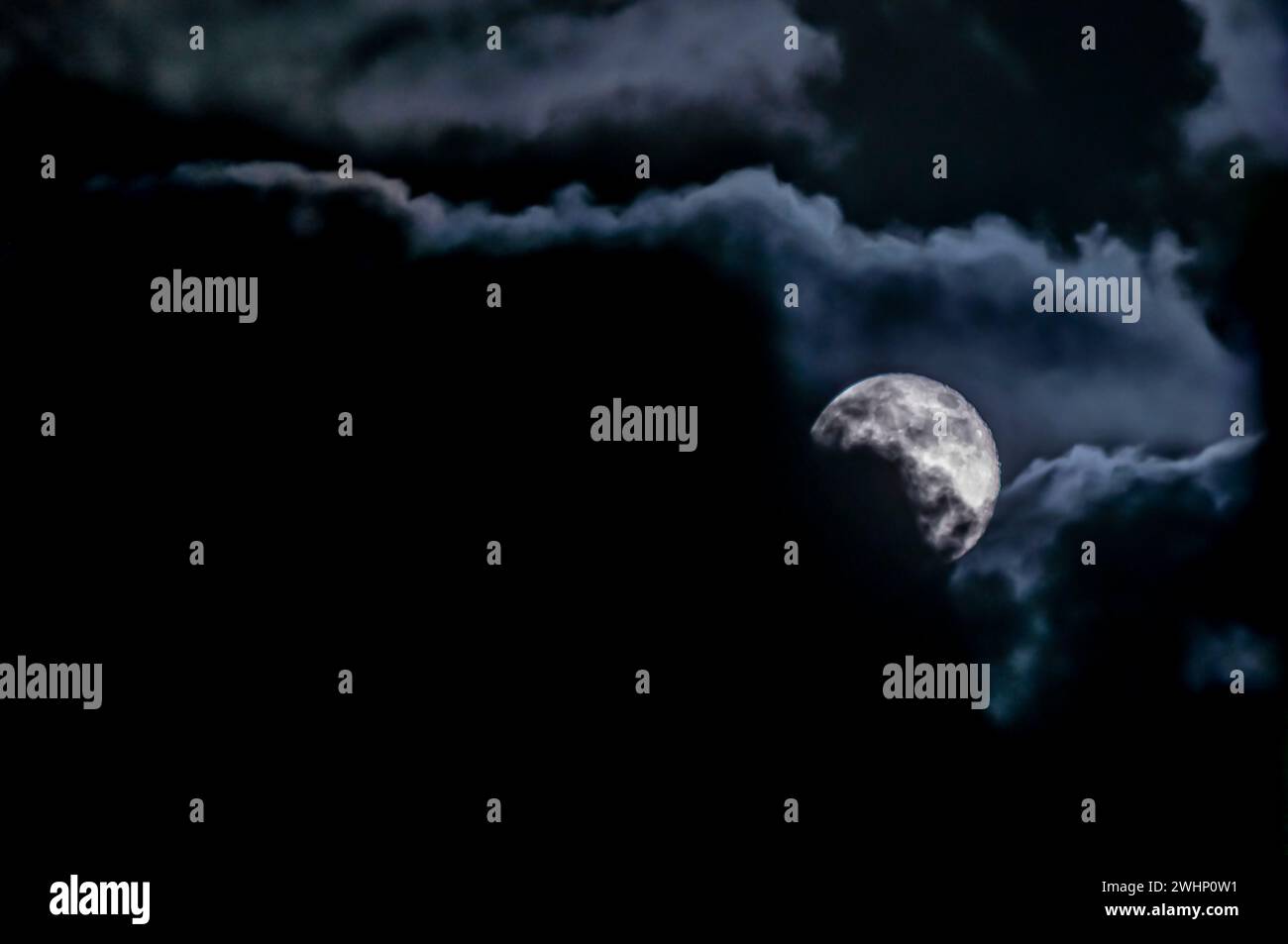 Full moon covered by clouds Stock Photo - Alamy