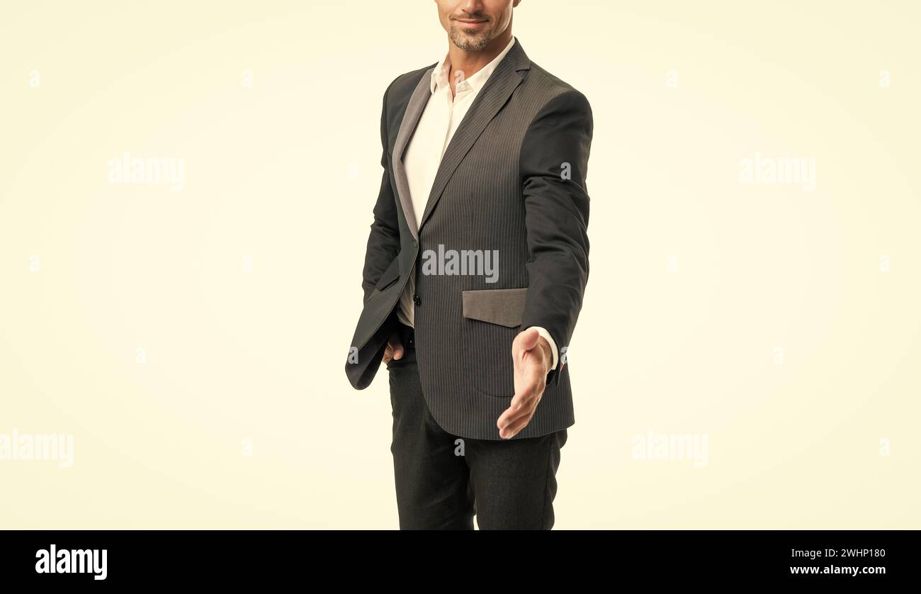Professional man crop view in formal suit stretching out hand for ...