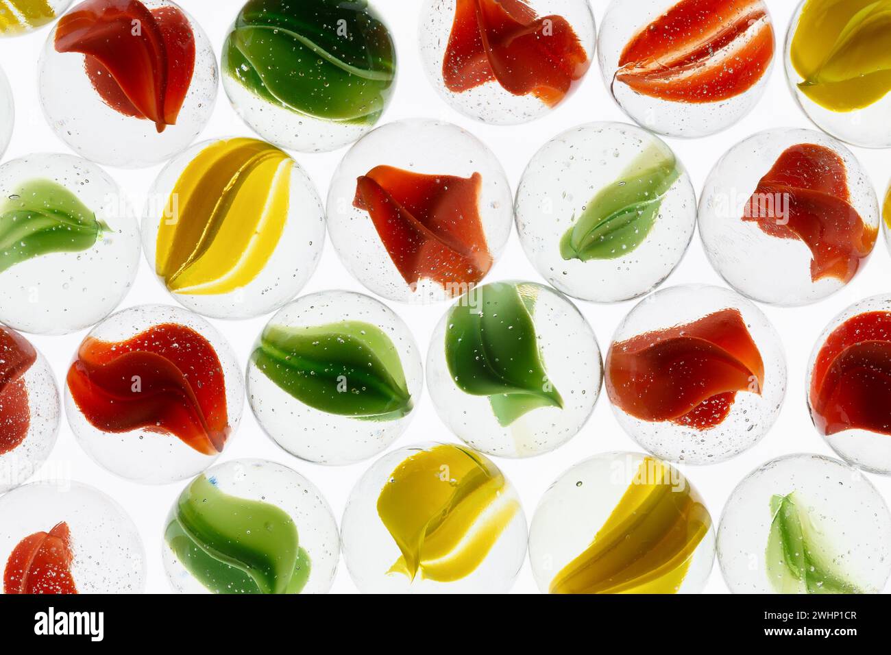 Glass transparent balls with an abstract multi-colored design inside on ...