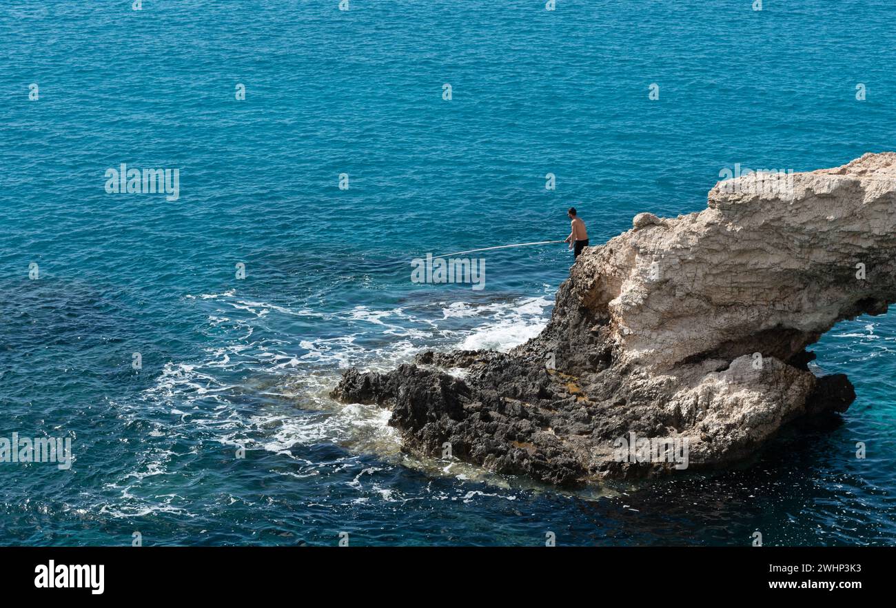 Unrecognized person fishing in the sea. Healthy relaxed lifestyle Stock ...