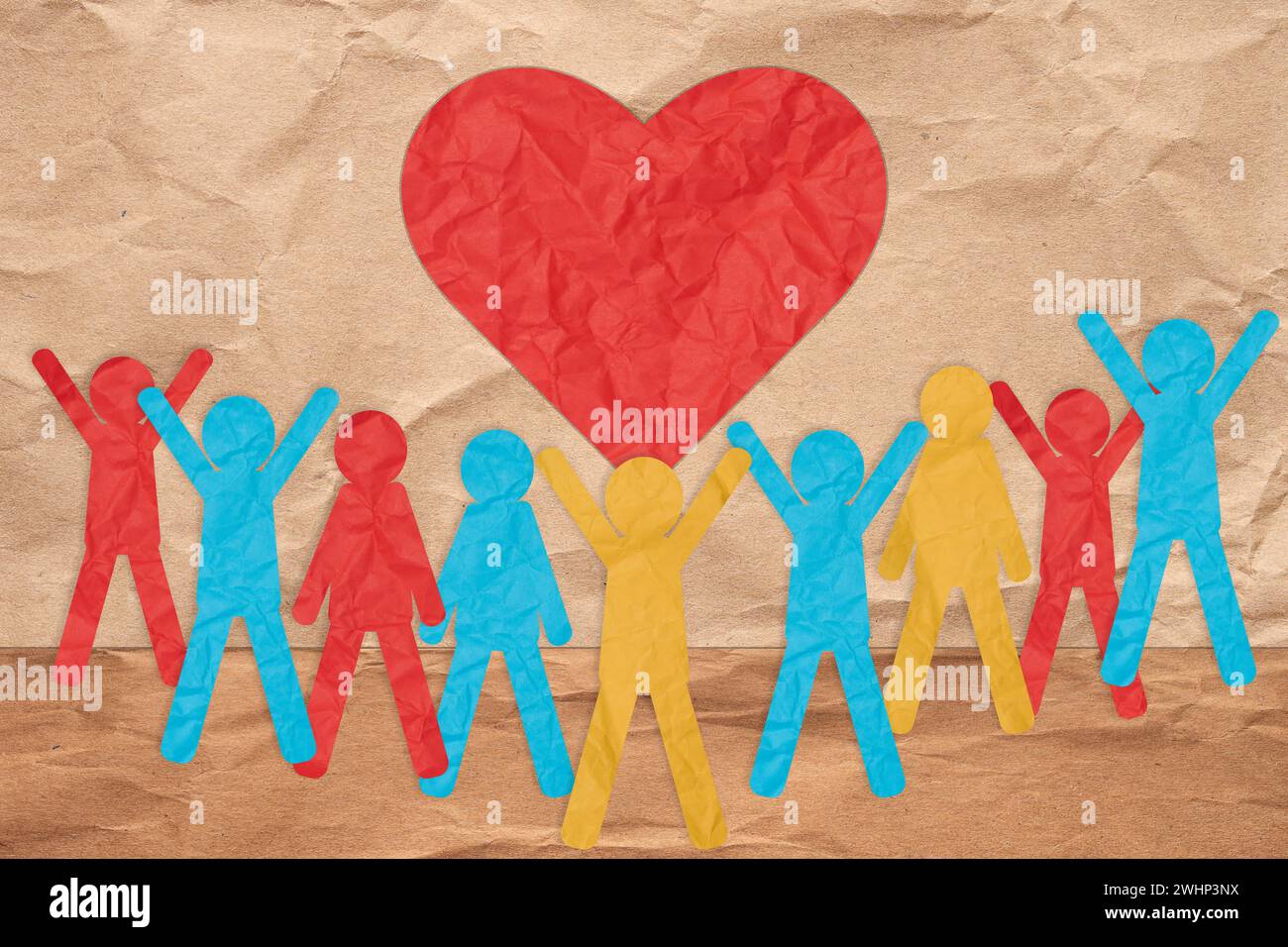 Paper colorful people and a red heart. The concept of love and kindness ...