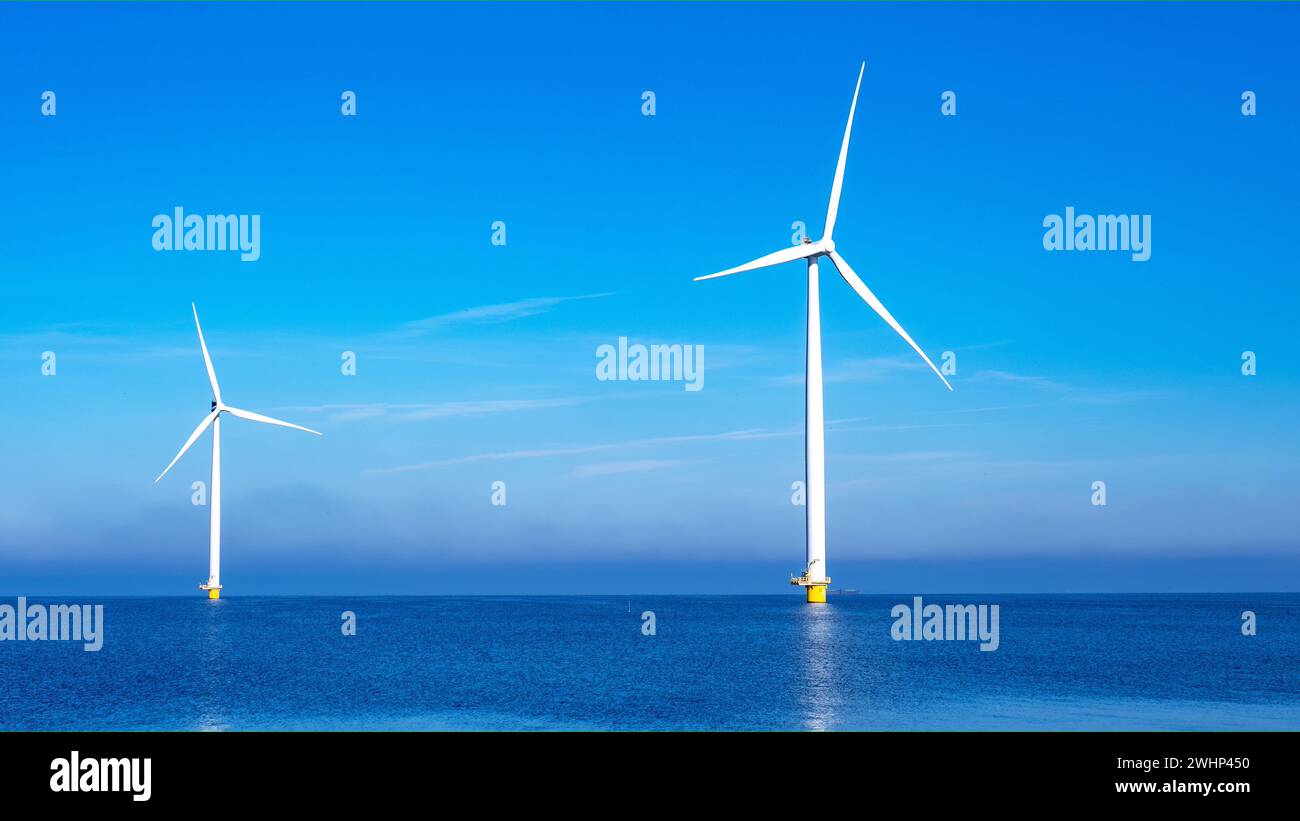 Windmill park with clouds and a blue sky, windmill park in the ocean ...